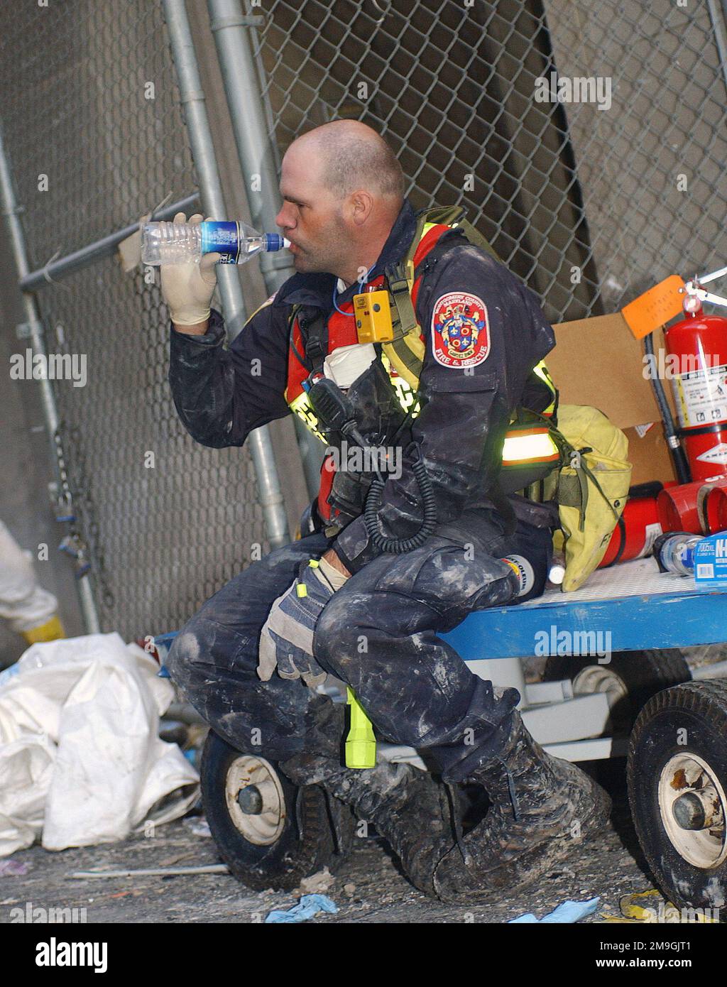 Taking a deep draught of water, a rescue worker from the Montgomery ...