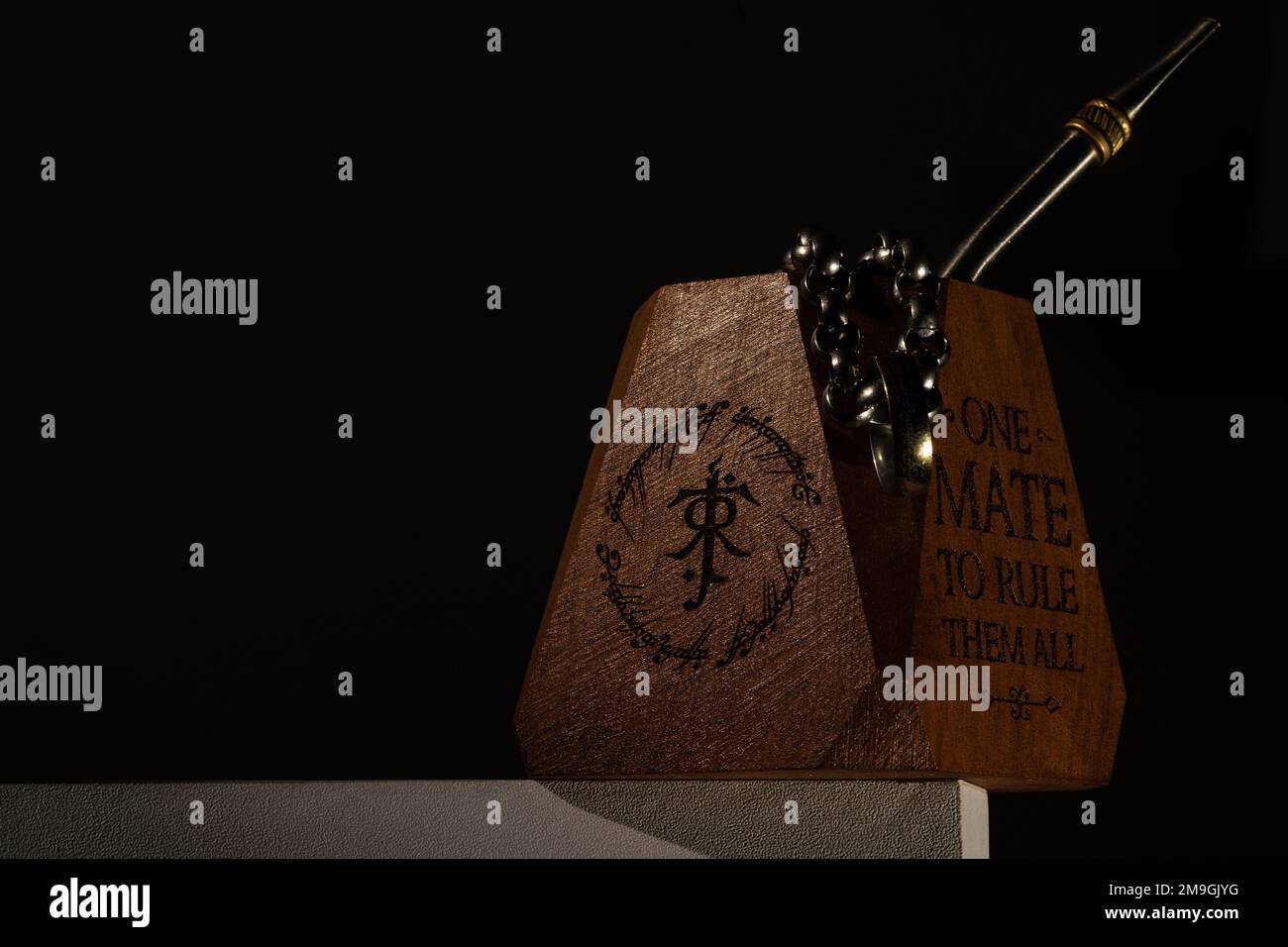 A personalized mate with Lord of the rings inscriptions over black ...