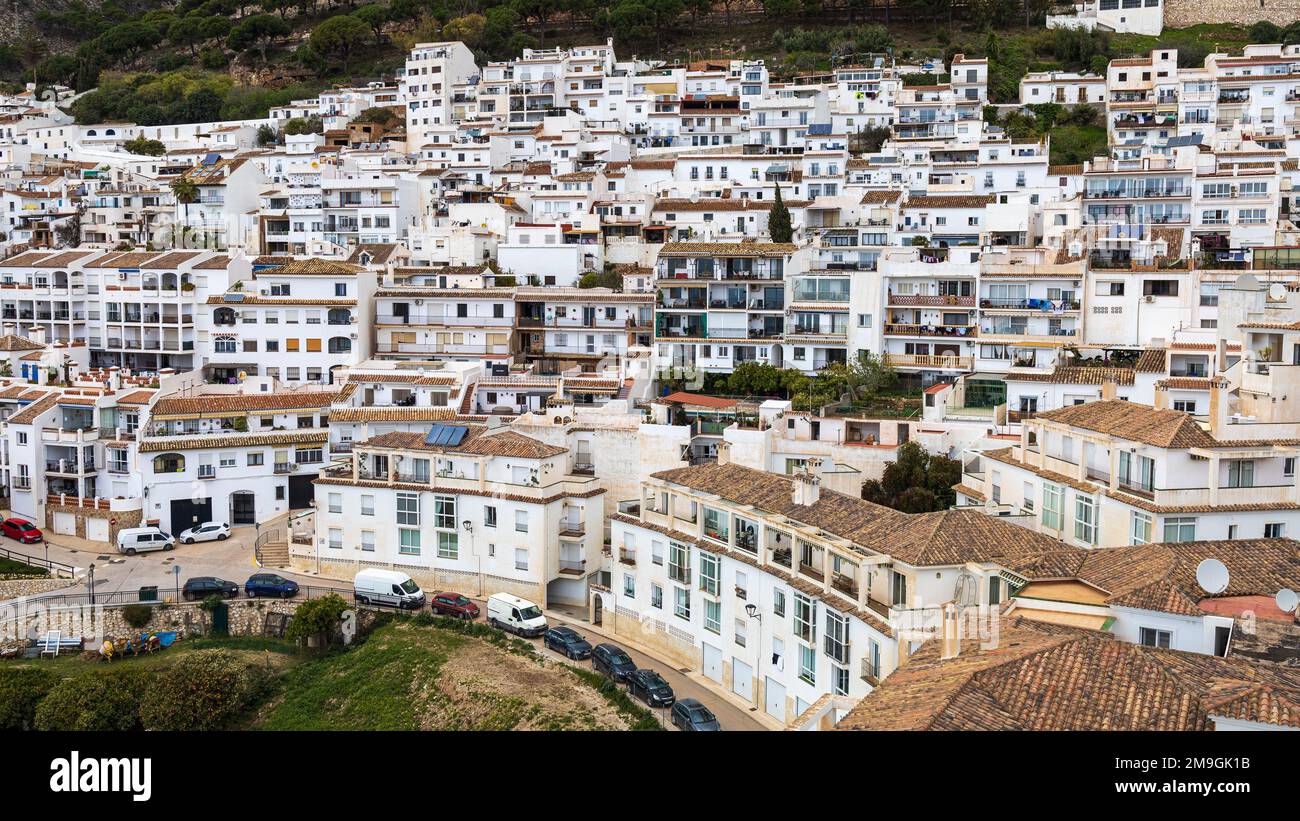Aerial view of white houses, stretches across the slope of the ...