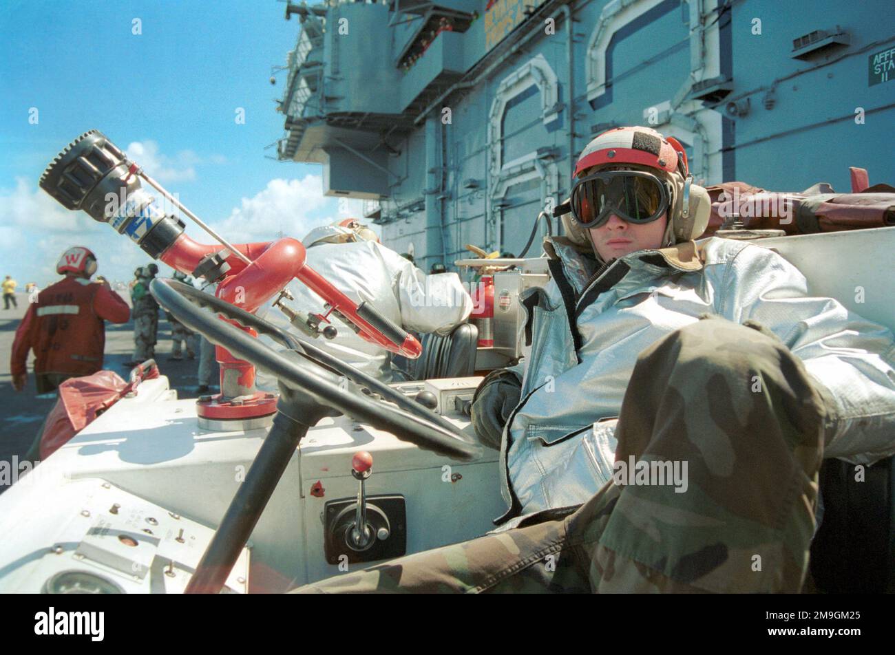 US Navy (USN) AIRMAN (AN) Shane Cummings, a member of the Crash and ...