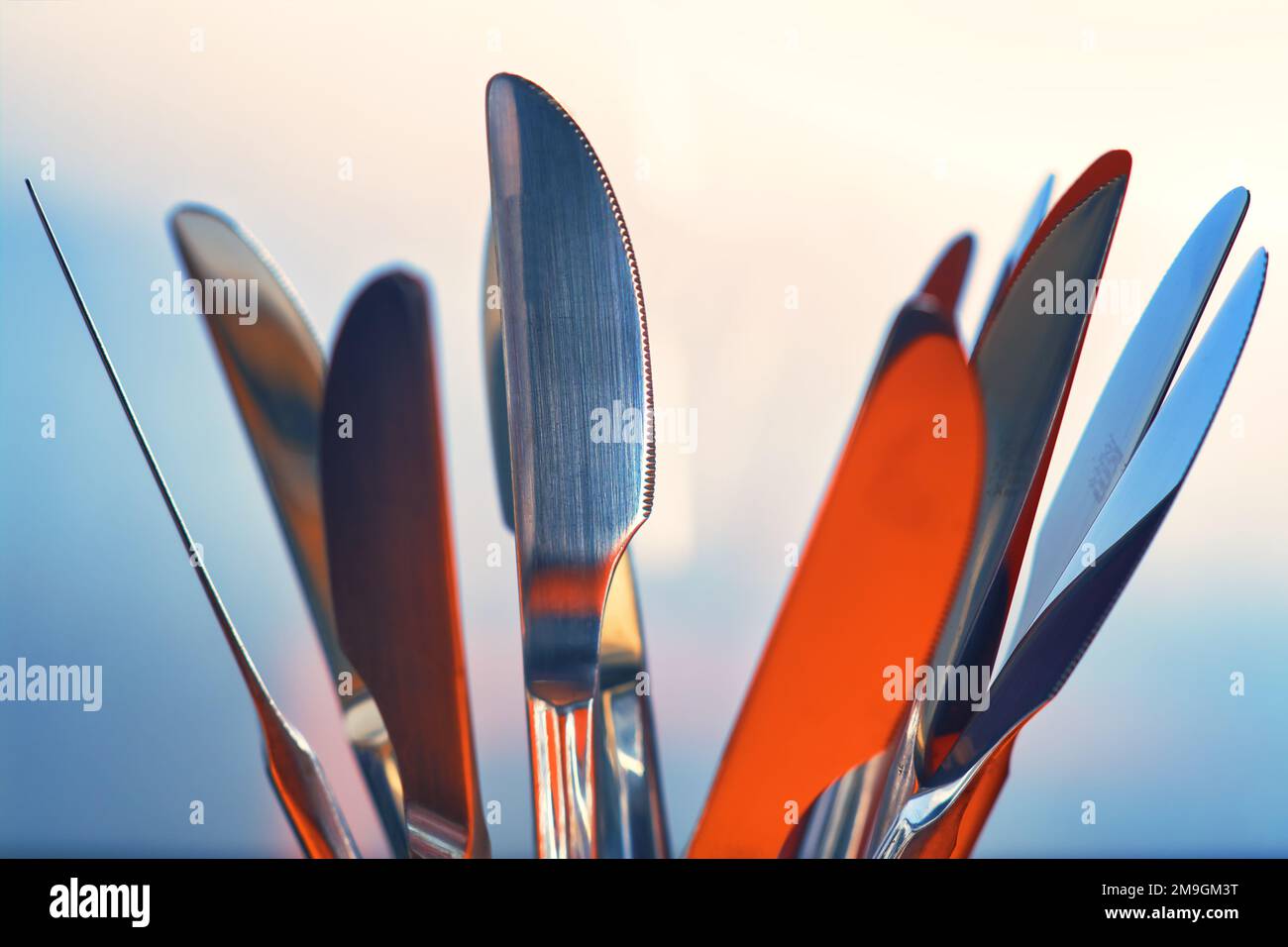 Close up of a messy group of table knives Stock Photo - Alamy