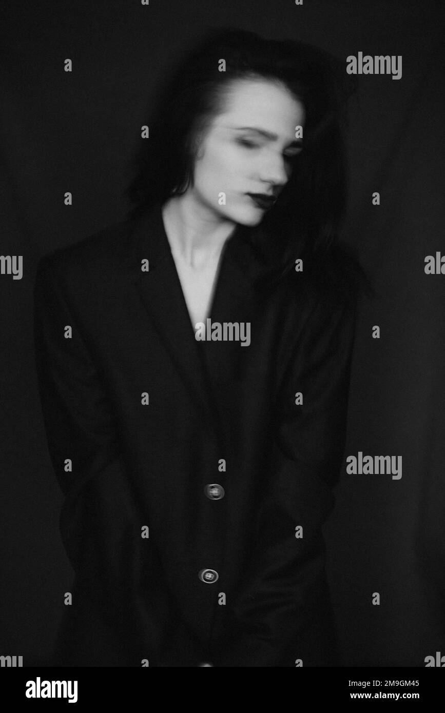 sad portrait of a lonely girl with a blurred face. Vintage style with ...