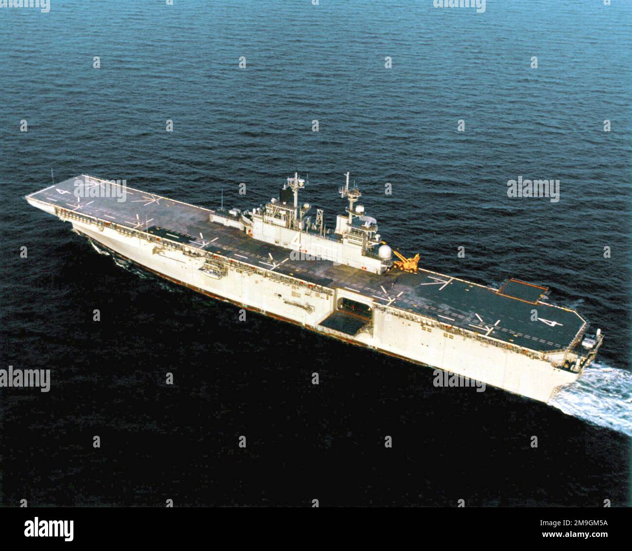 A high aerial port view of the Wasp Class Amphibious Assault Ship ...