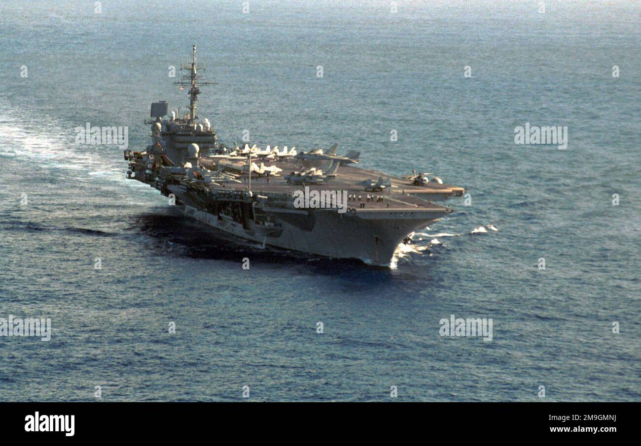 A starboard bow view of the Aircraft Carrier USS KITTY HAWK (CV 63 ...