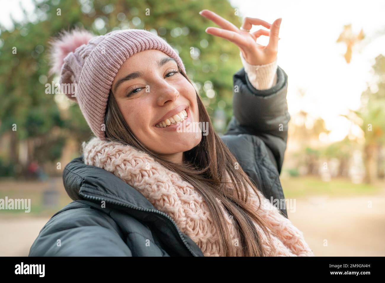 Young beautiful woman smiling taking selfie photo at university campus ...