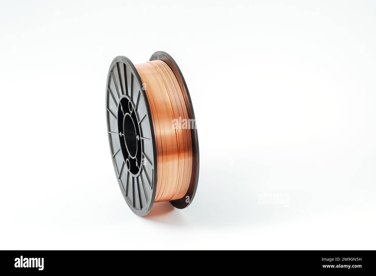 Welding wire spool on a white background Stock Photo - Alamy