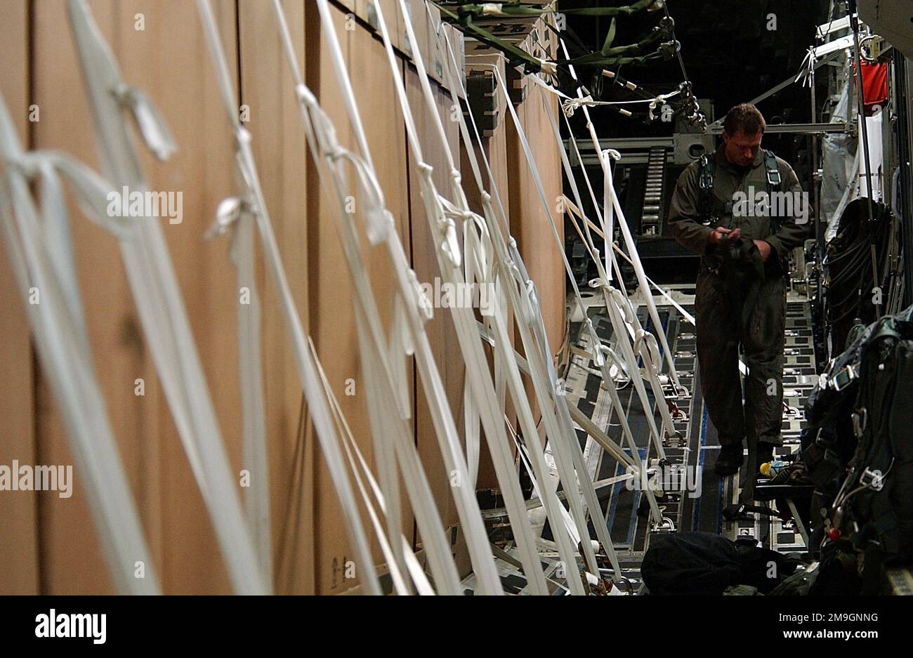 An Air Force C-17A Globemaster III loadmaster prepares to inspect the ...