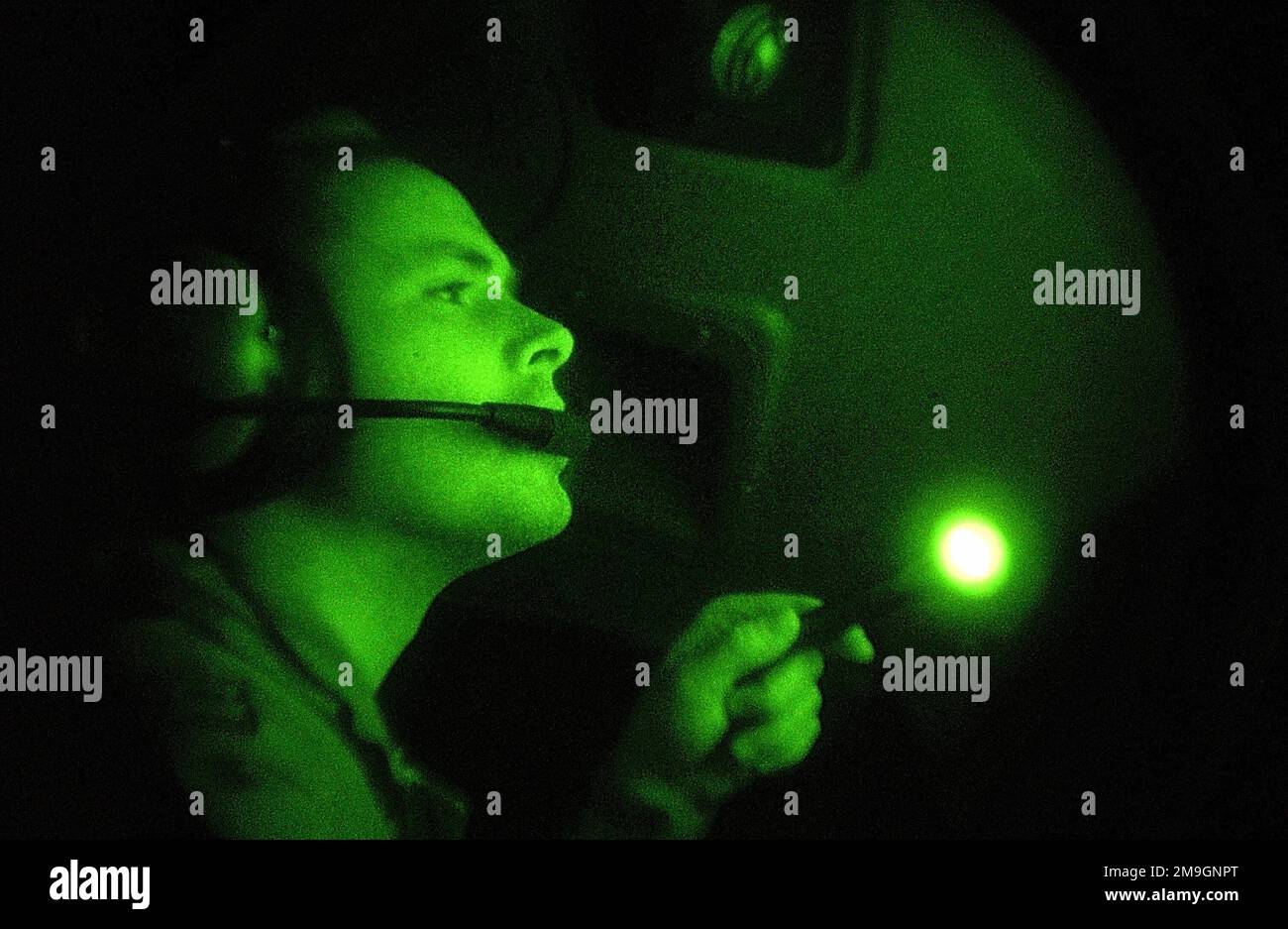 011006-F-1644L-033. [Complete] Scene Caption: As seen through a Night ...