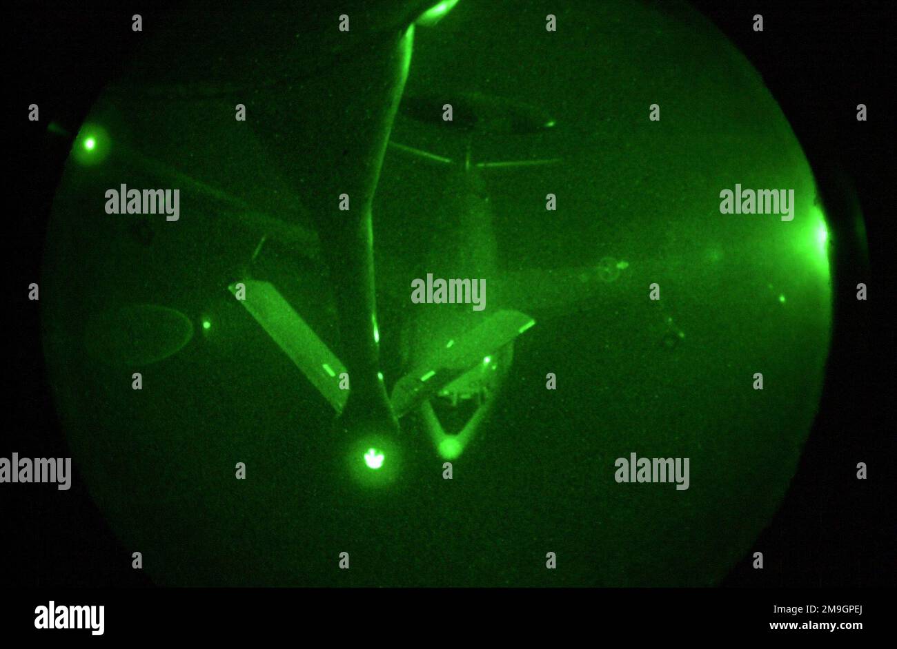 At night, as seen through the green glow of a night scope, an E-3C ...