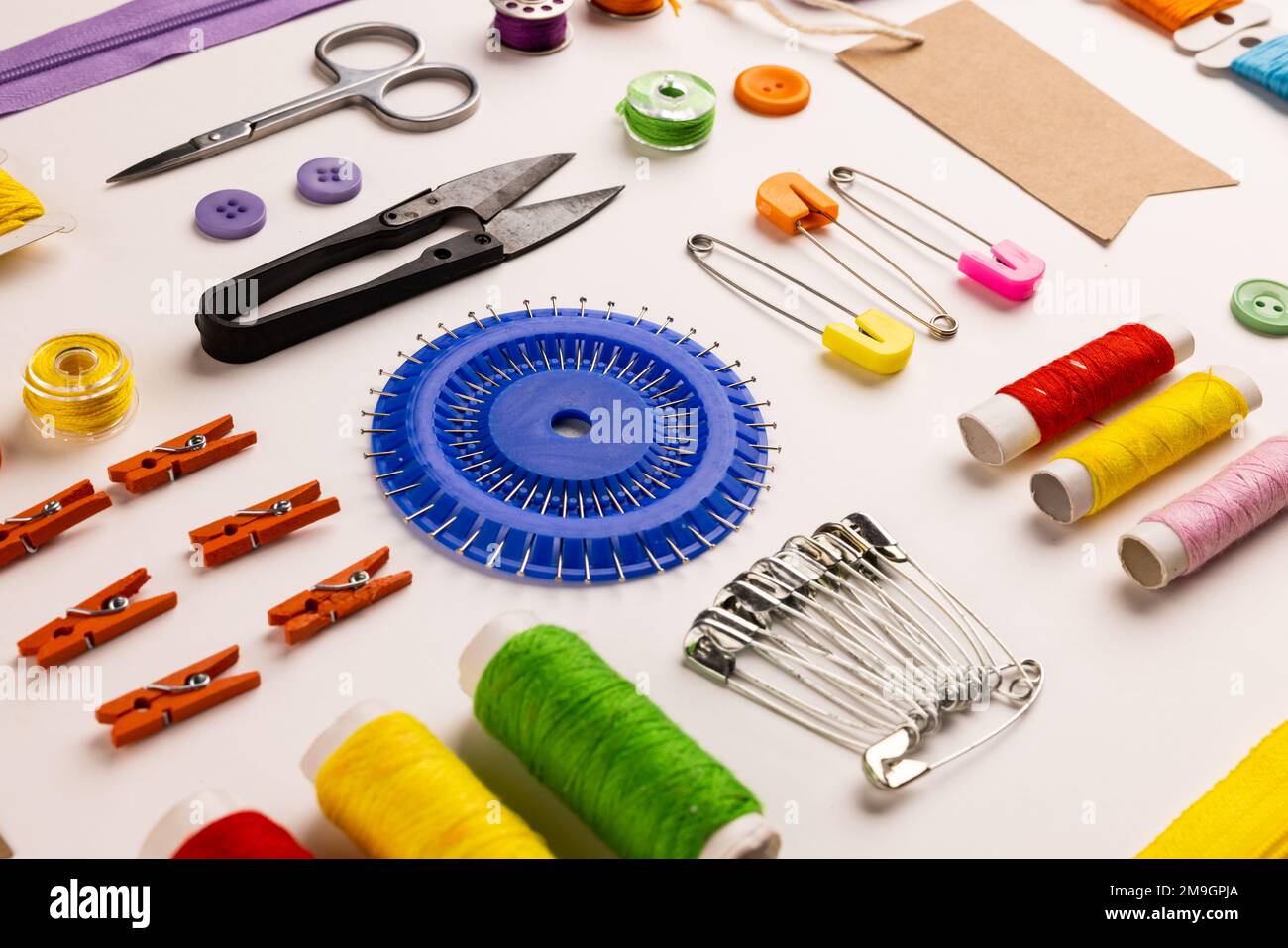 Image of sewing materials with scissors, buttons and threads on cream ...