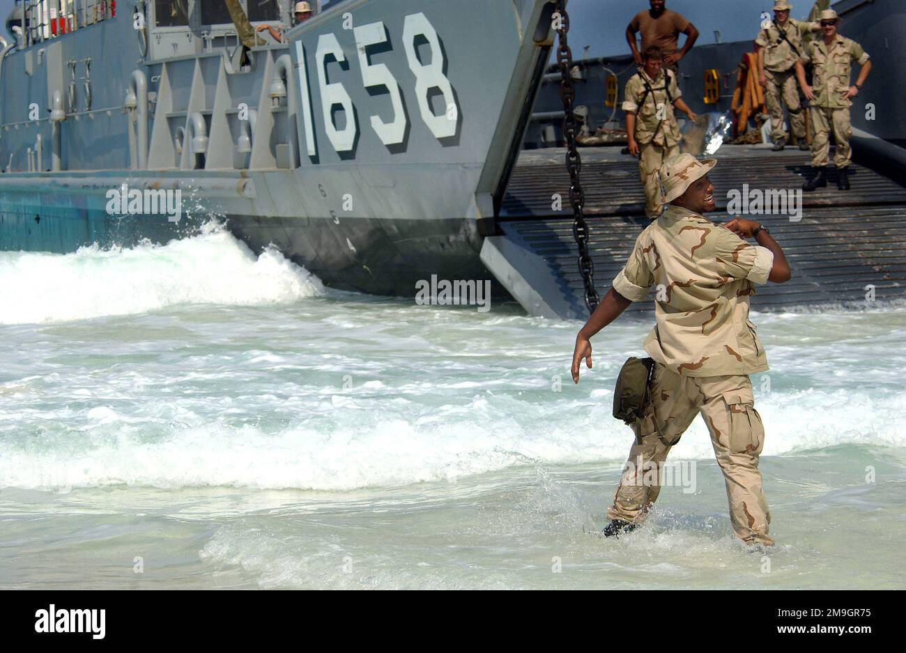 011013-F-0193C-008. [Complete] Scene Caption: Following the rank order ...