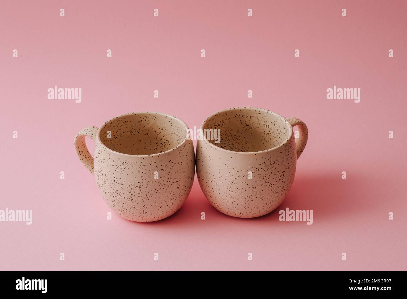 Two porcelain empty cups on a pink background, copy space Stock Photo ...