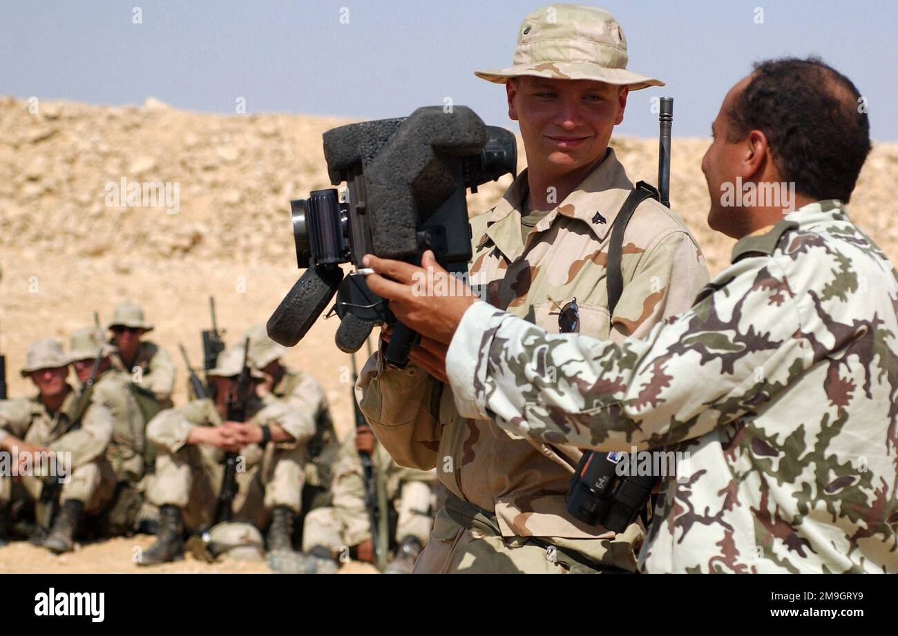 011015-F-0193C-003. [Complete] Scene Caption: Corporal Scott Bender ...