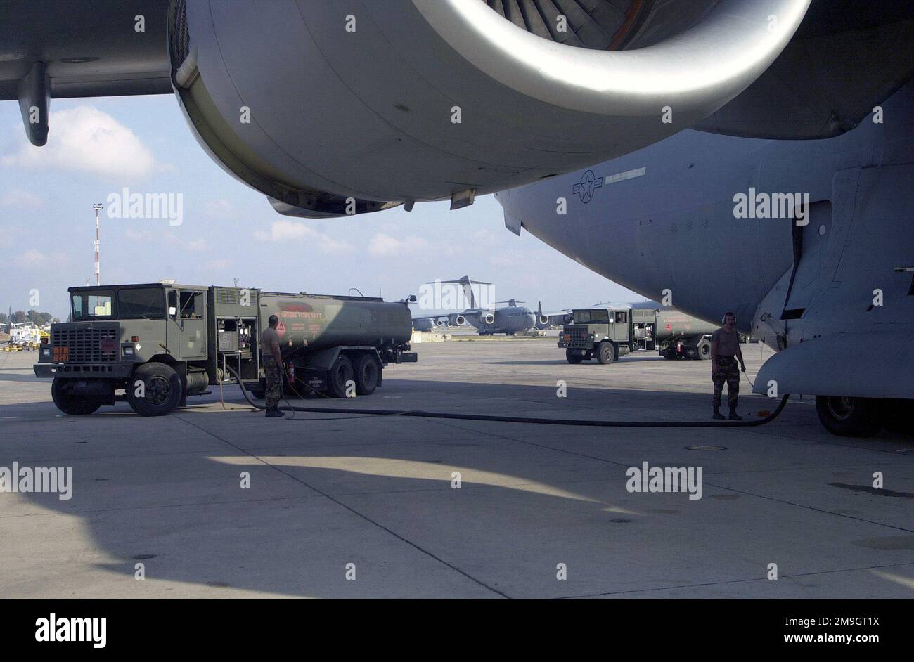 R-11 fuel trucks refuel C-17 Globemaster IIIs, on the ramp at Naval Air ...