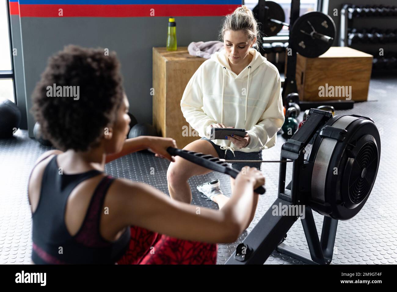 Woman using training machine hi-res stock photography and images - Alamy