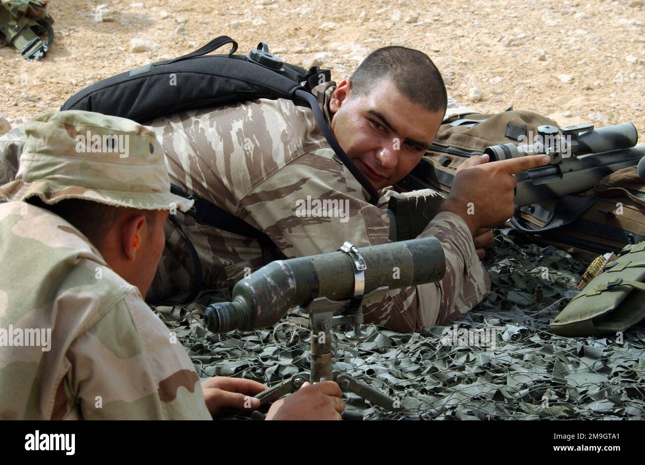 011016-F-7203T-005. [Complete] Scene Caption: A Greek sharp shooter ...