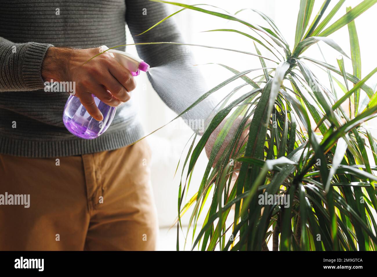 Man home bottle of water hi-res stock photography and images - Alamy