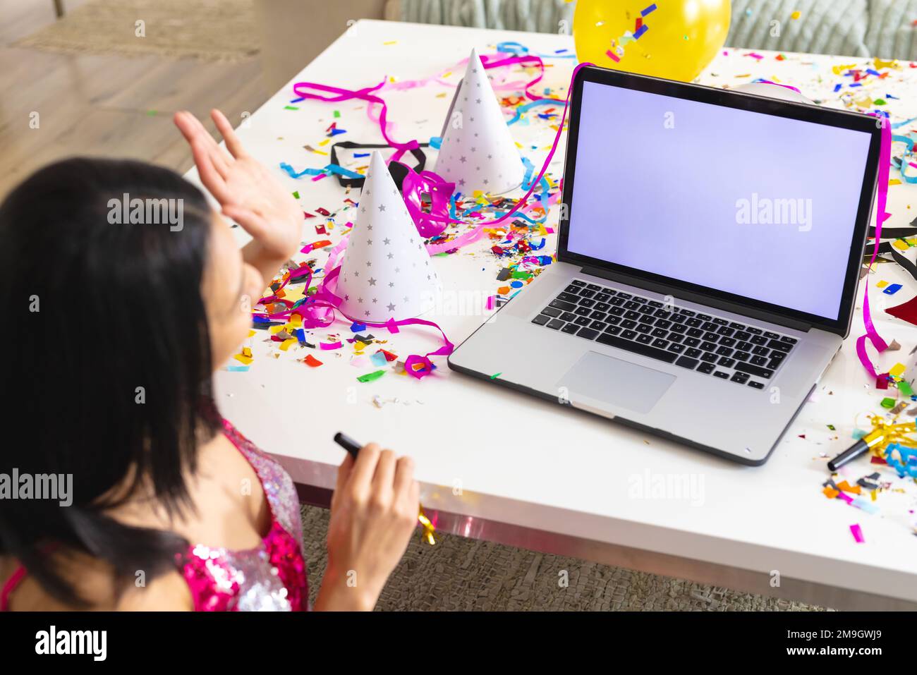 Image of biracial woman using laptop with copy space on screen having ...