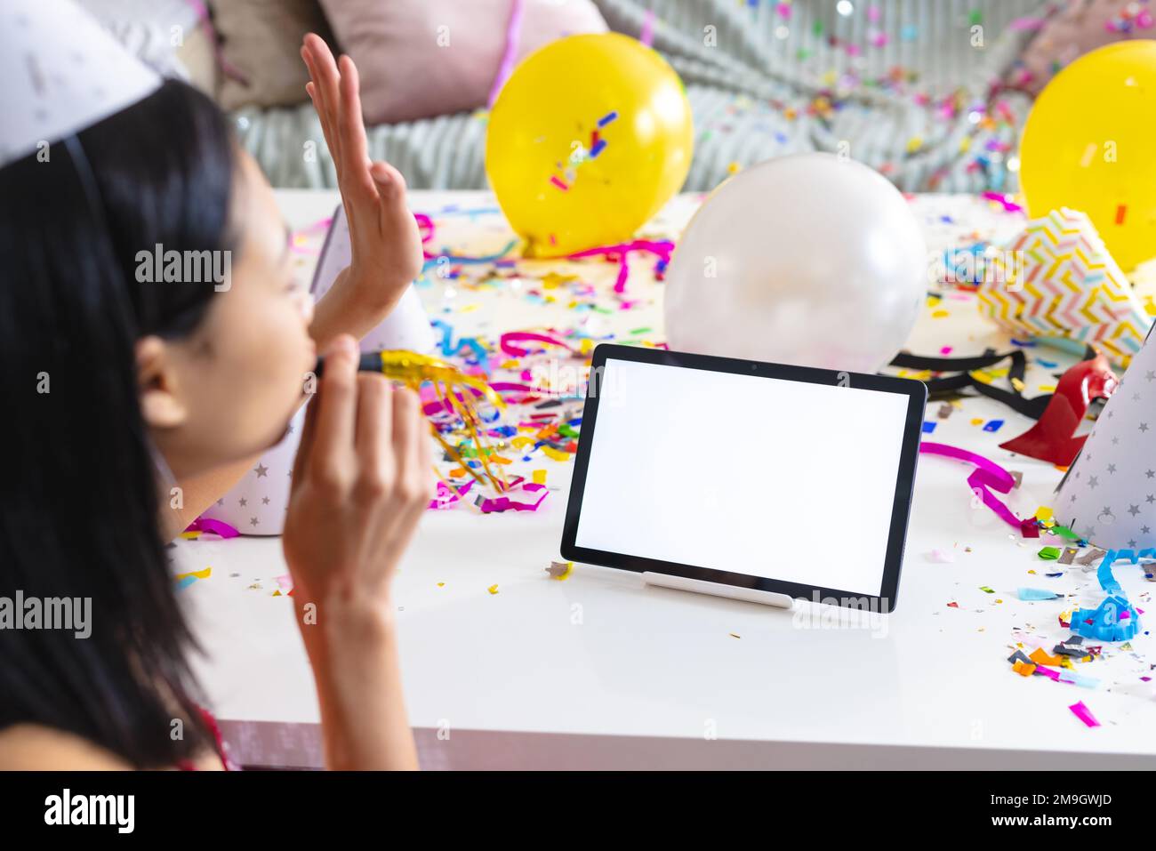 Image of biracial woman using tablet with copy space on screen having ...