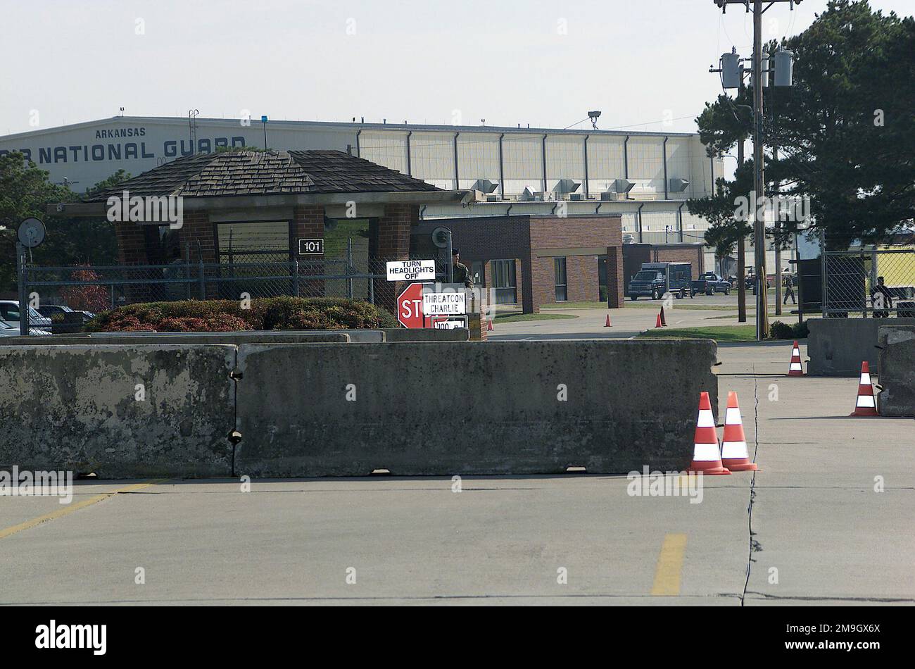 Barriers erected at the entrance of Ebbing ANG Base help ensure that ...