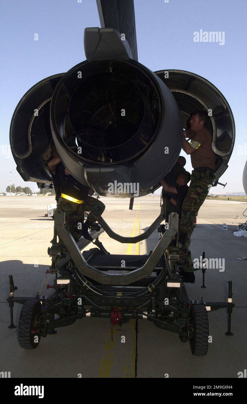 Deployed aircraft maintainers, position an engine cart under the Pratt ...