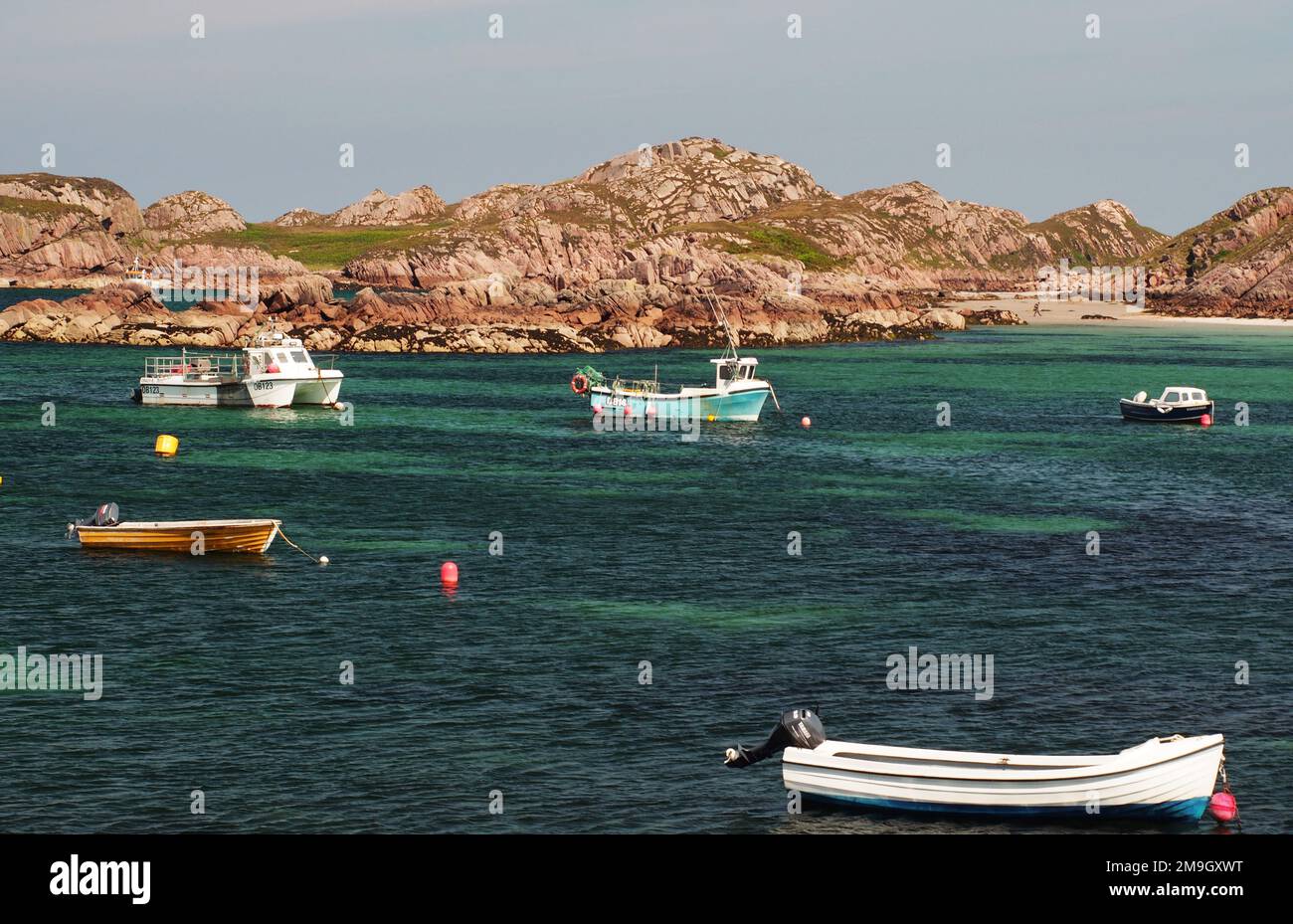 A group of small craft at anchor in the bay at Fionnphort, Mull ...