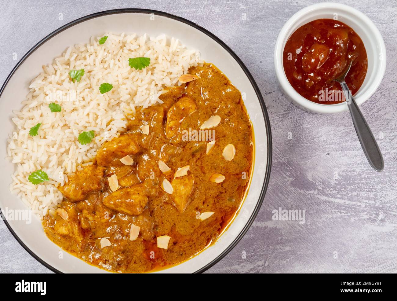 chicken korma and rice with mango chutney from above Stock Photo - Alamy