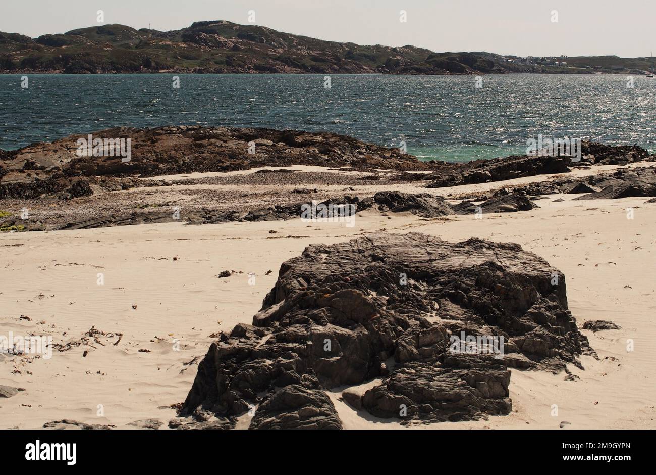White Strand of the Monk's beach, Iona, Scotland Uk on a sunny summer's ...
