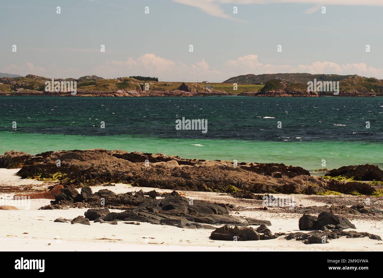 White Strand of the Monk's beach, Iona, Scotland Uk on a sunny summer's ...