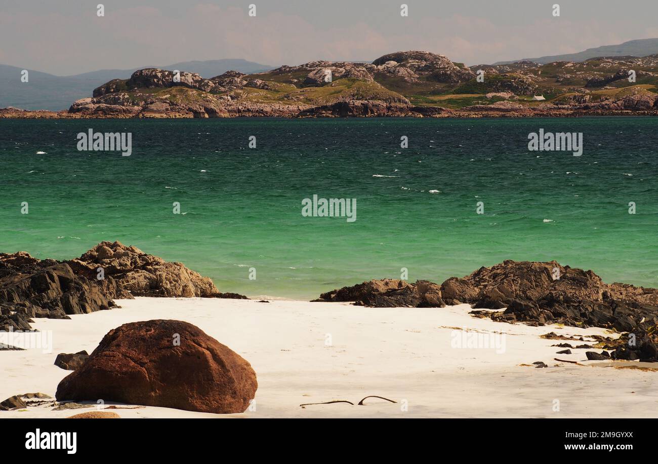 White Strand of the Monk's beach, Iona, Scotland Uk on a sunny summer's ...