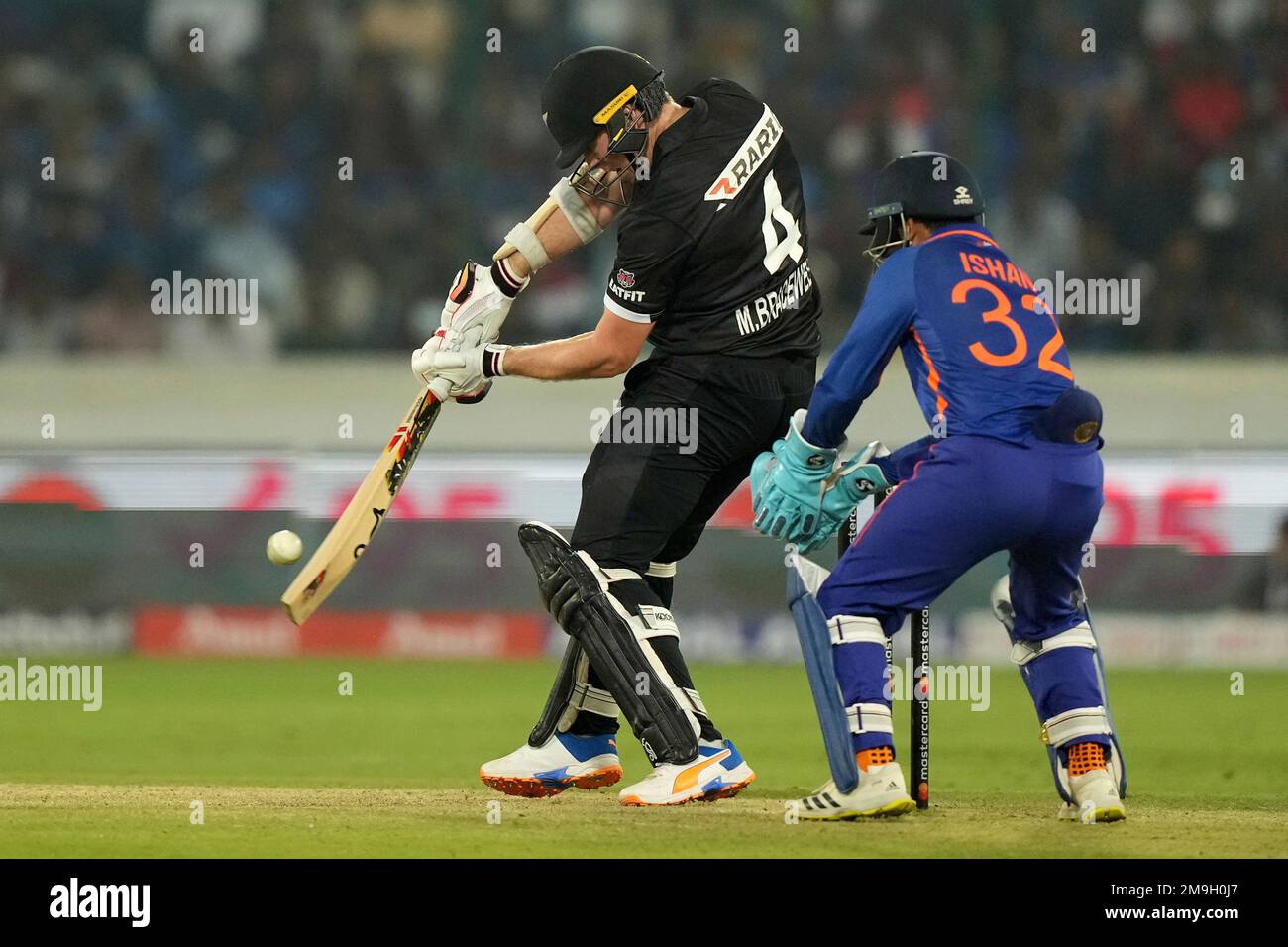 New Zealand's Michael Bracewell, left, plays a shot during the first ...