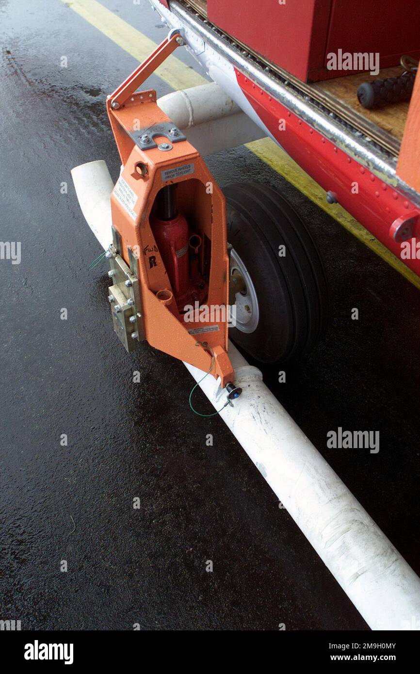 Close-up photo of a temporary wheel attached to a landing strut on a ...
