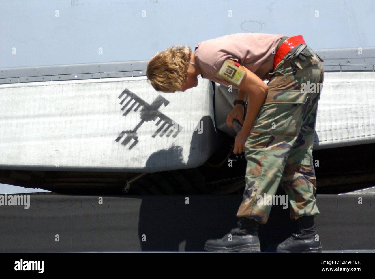 An Air Force crewchief from the 28th Air Expeditionary Wing, conducts a ...