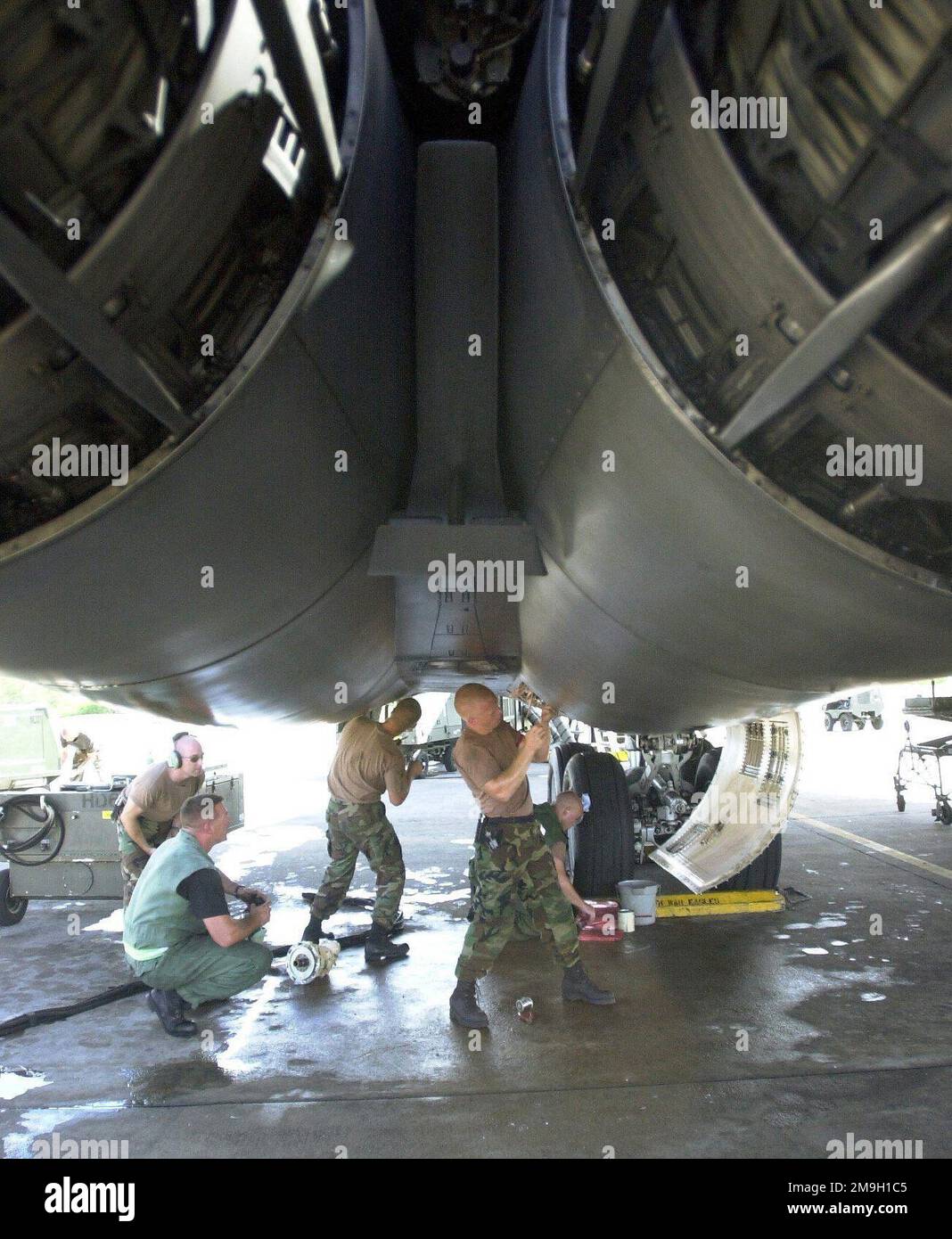 Air Force crewchiefs from the 28th Air Expeditionary Wing, service a B ...