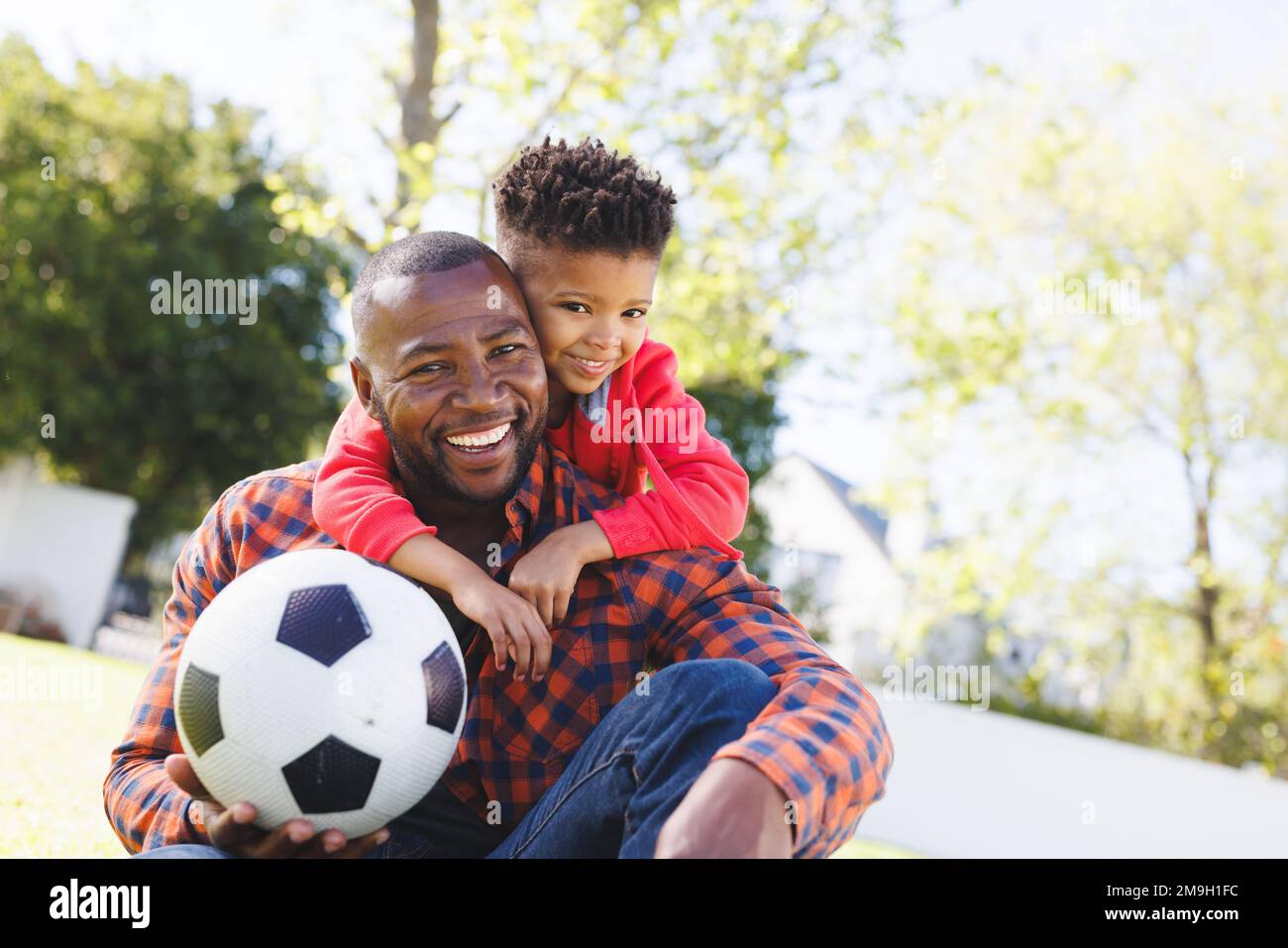 Portrait smiling little daughter holding hi-res stock photography and ...