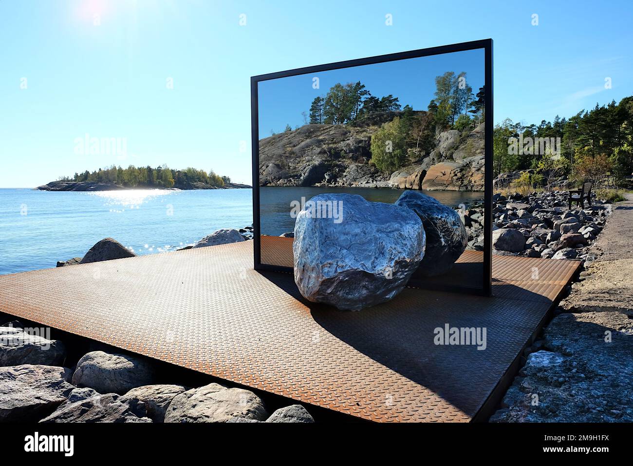 Open air installation Big Be-Hide mirror between two big rocks on the ...