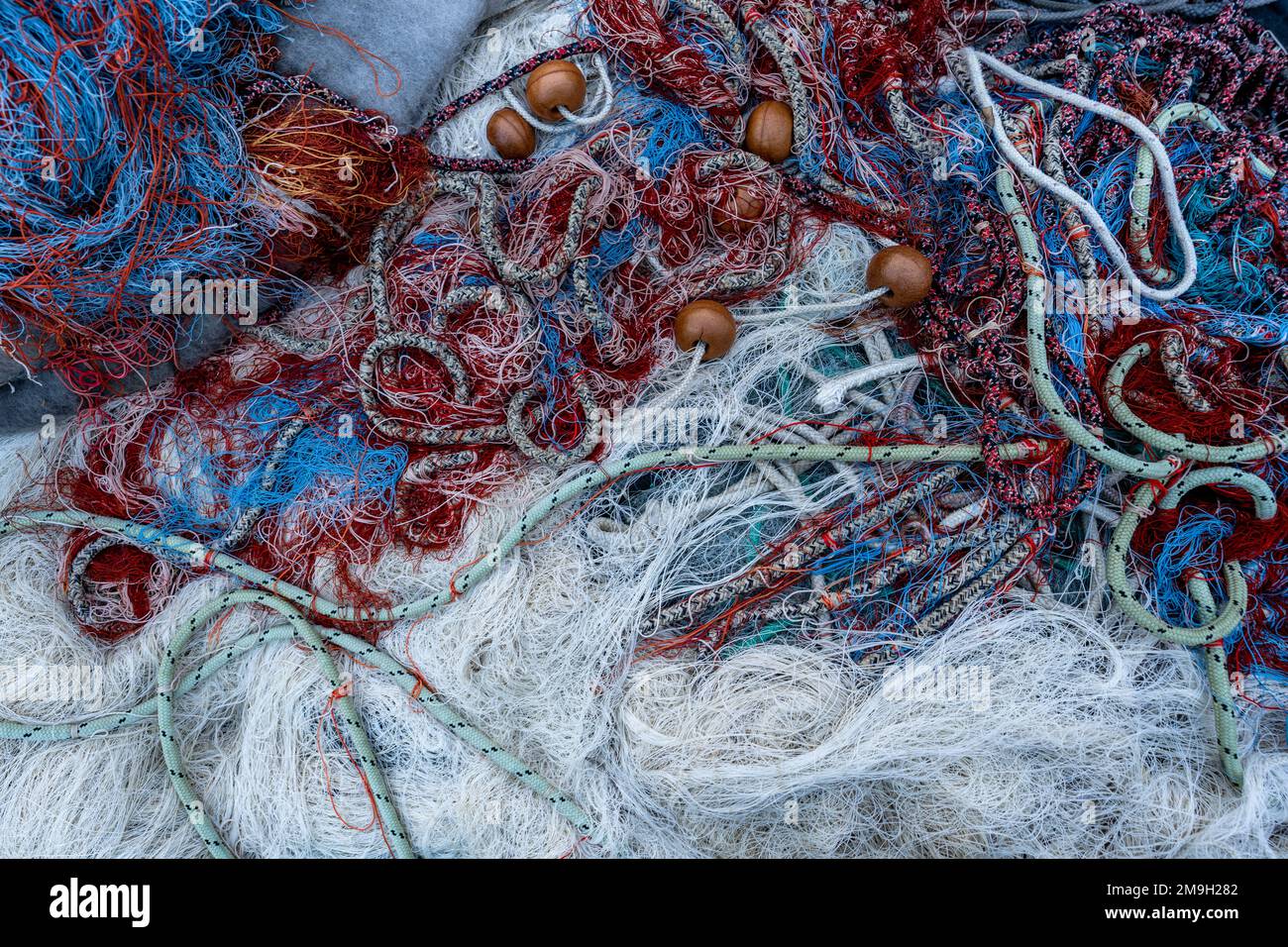 Colorful Fishing Net and Buoy, background texture Stock Photo - Alamy