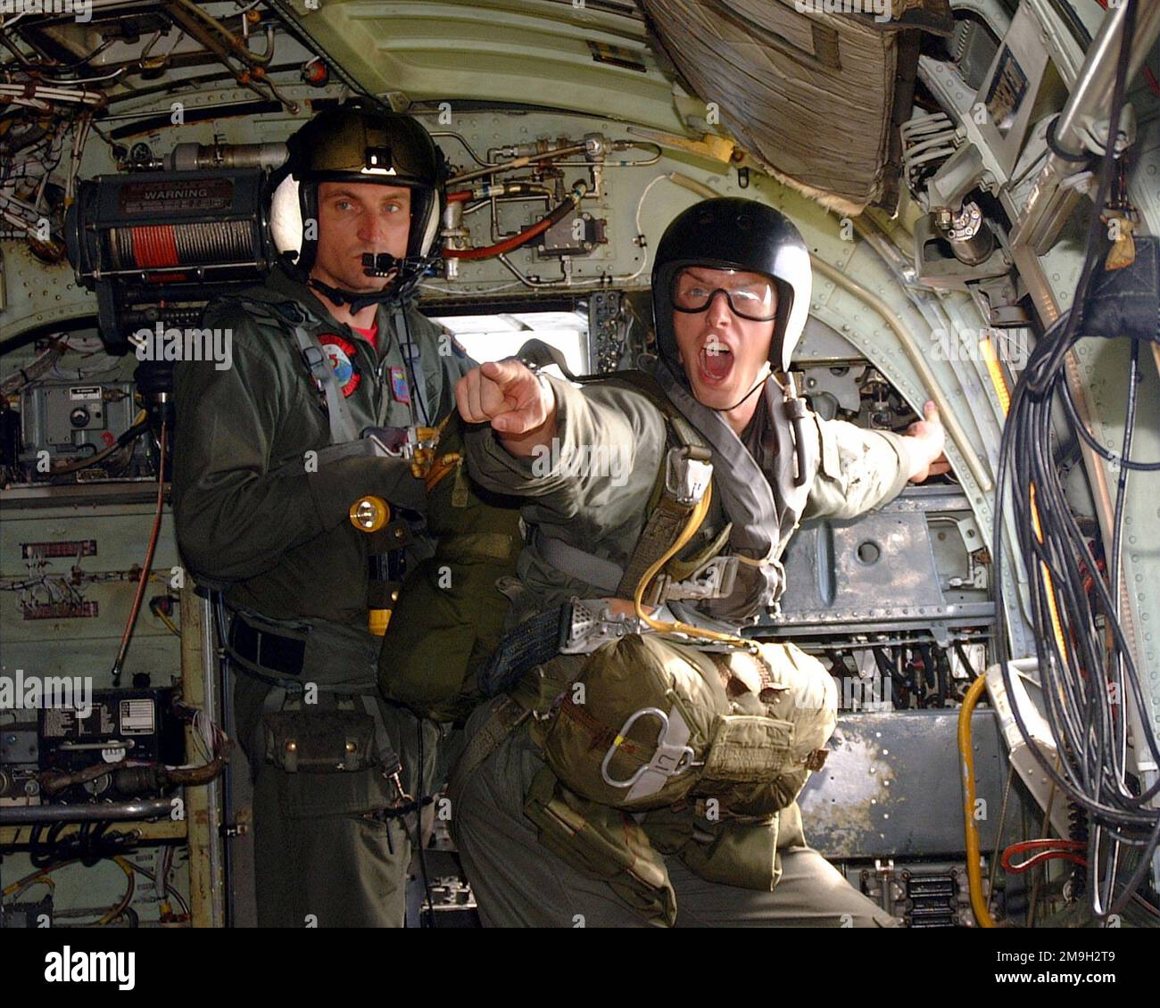 A Jump MASTER from Explosive Ordnance Disposal Mobile Unit Five, yells ...