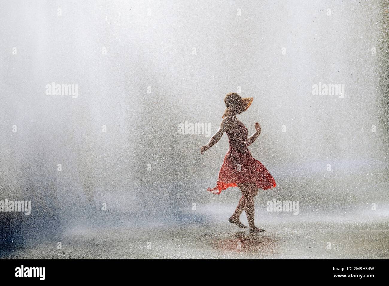 Woman in red dress dancing in fountain, International Fountain, Seattle ...