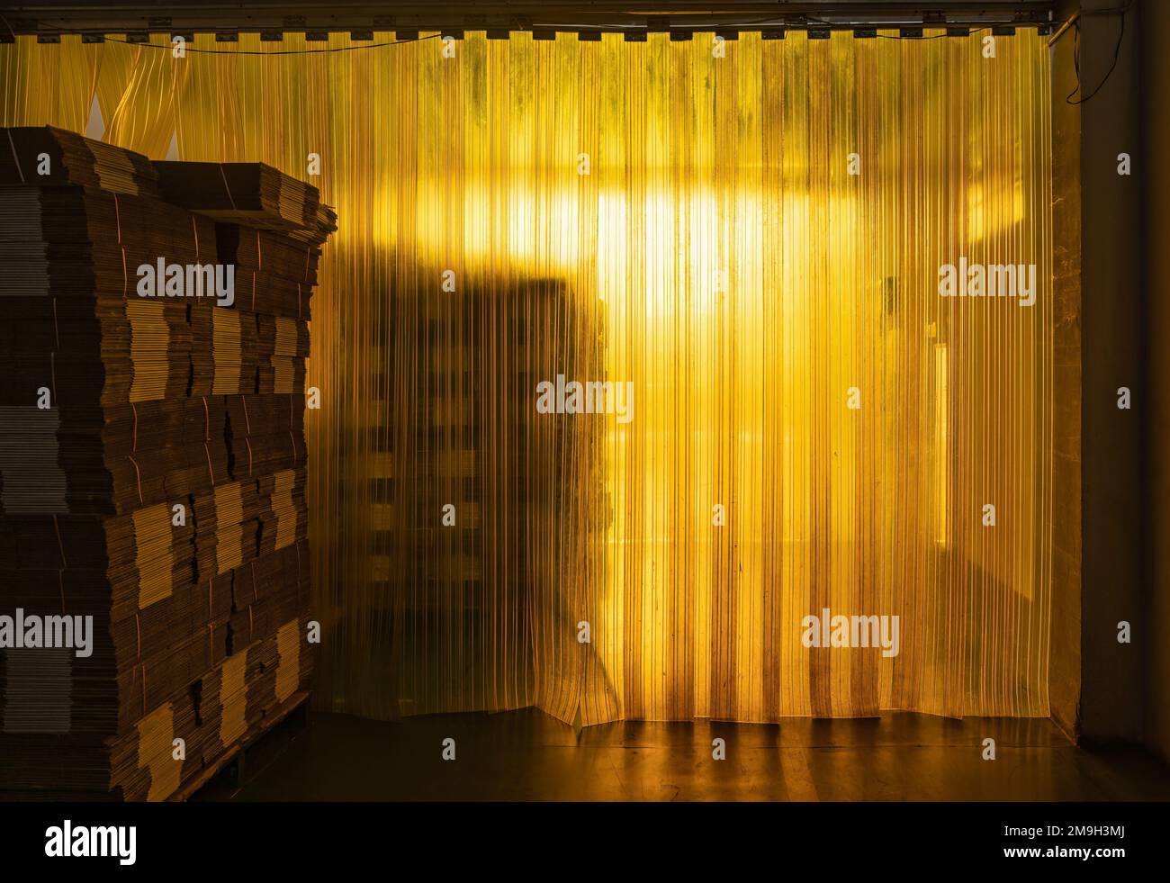 Yellow warehouse storage with stacked cardboard package and export ...