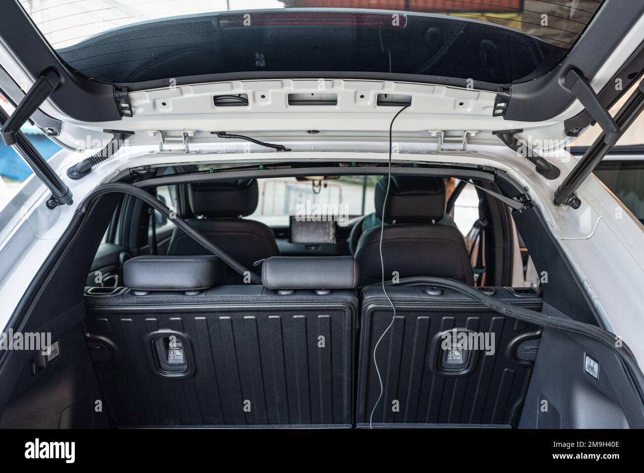 Rear of an SUV car with unpack parts and camera equipment installed in ...
