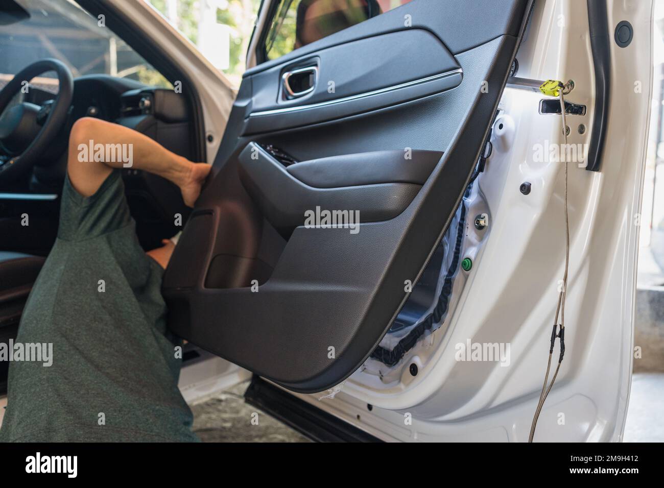 Mechanic man unpacking vehicle door part for checking car problem in ...