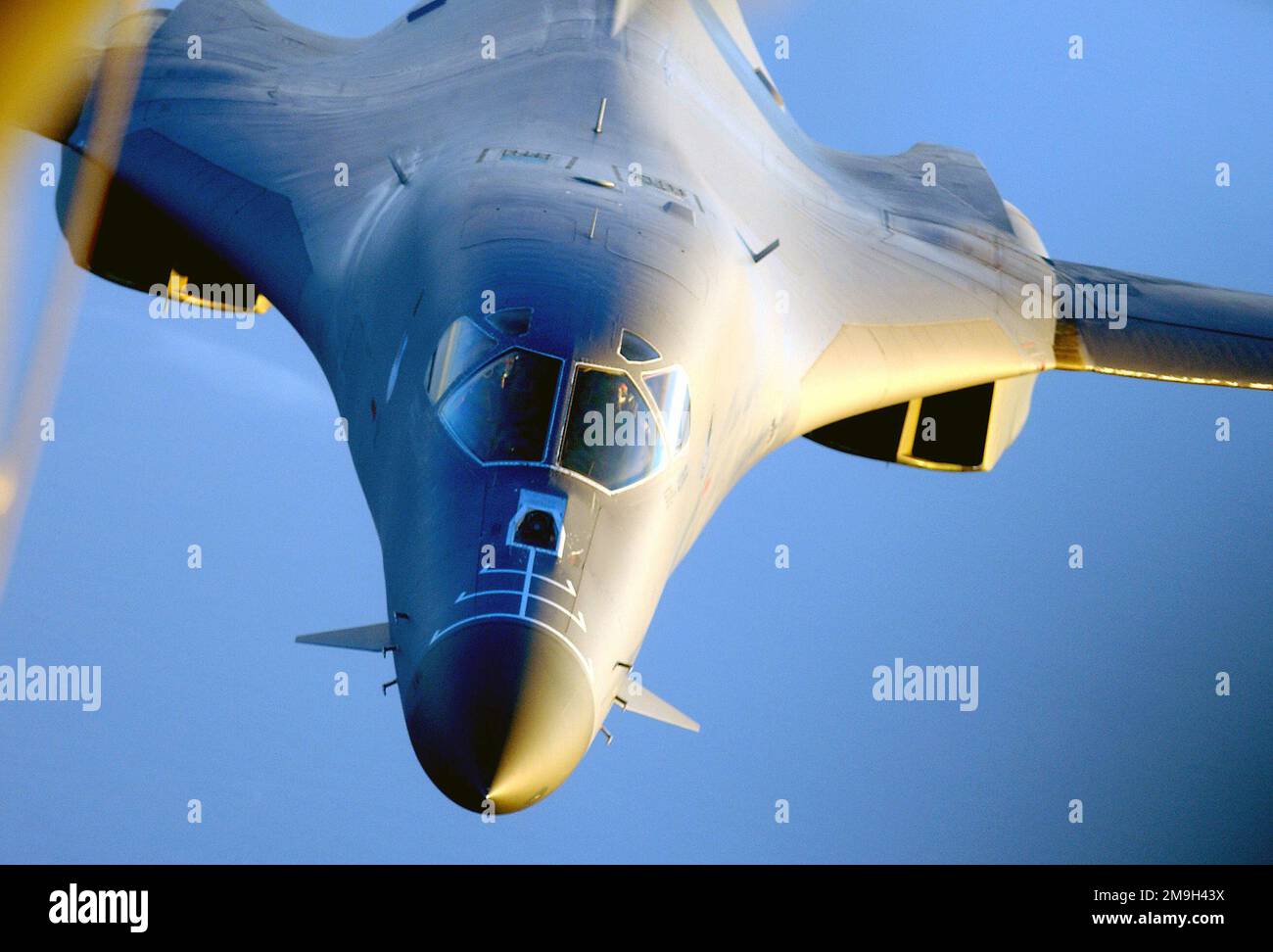 A B-1B Lancer from the 28th Air Expeditionary Wing (EW), maneuvers to ...