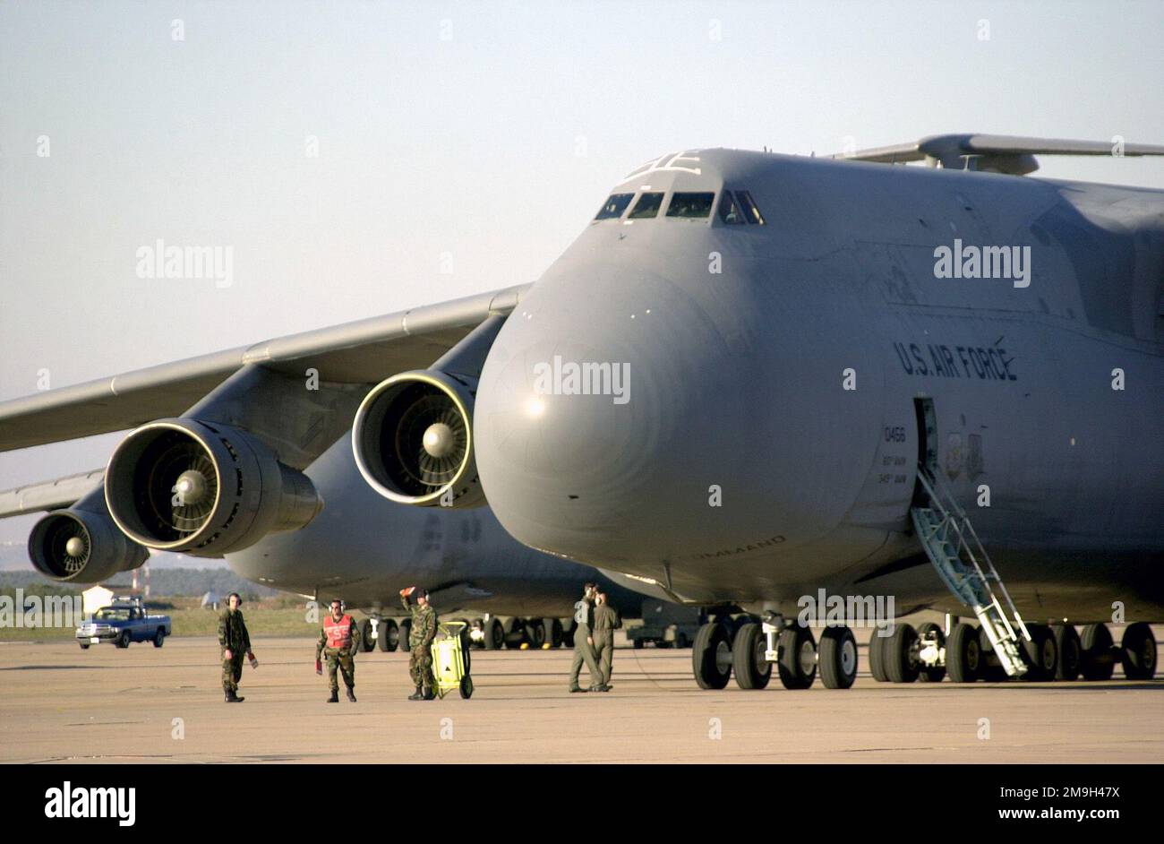 A ground crew unloads a C-5 Galaxy cargo aircraft on Moron Air Base ...