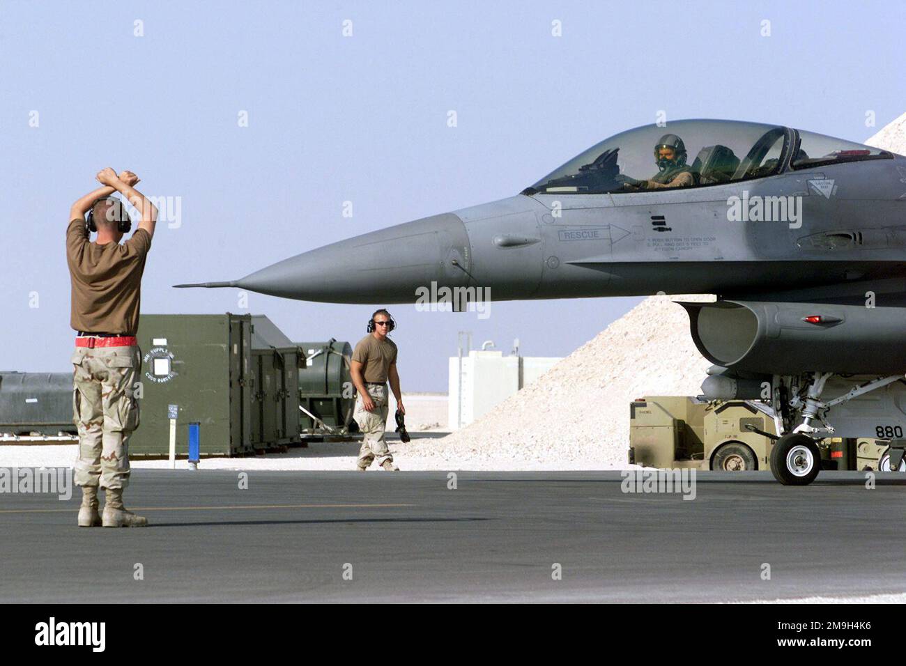 AIRMAN First Class (A1C) Charles P. Kapinos, gives the full-stop sign ...