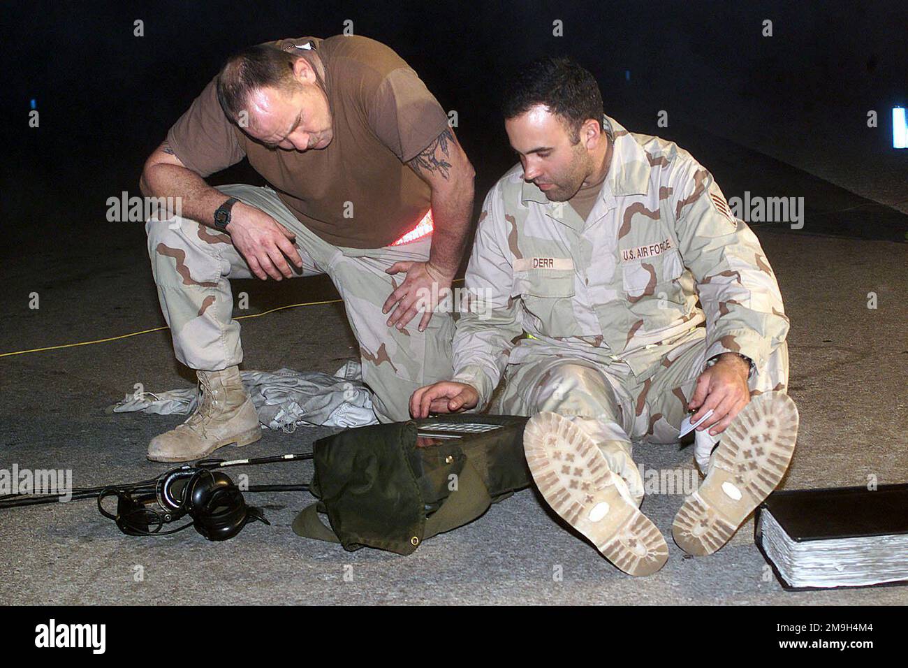 STAFF Sergeant (SSGT) Paul Derr uploads an Engine Diagnostics Unit (EDU ...
