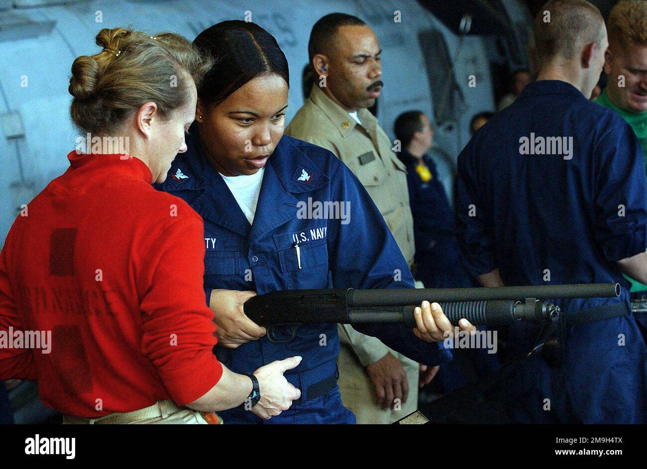 US Navy CHIEF Aviation Ordnanceman Kimberly Parkhurst provides shotgun ...