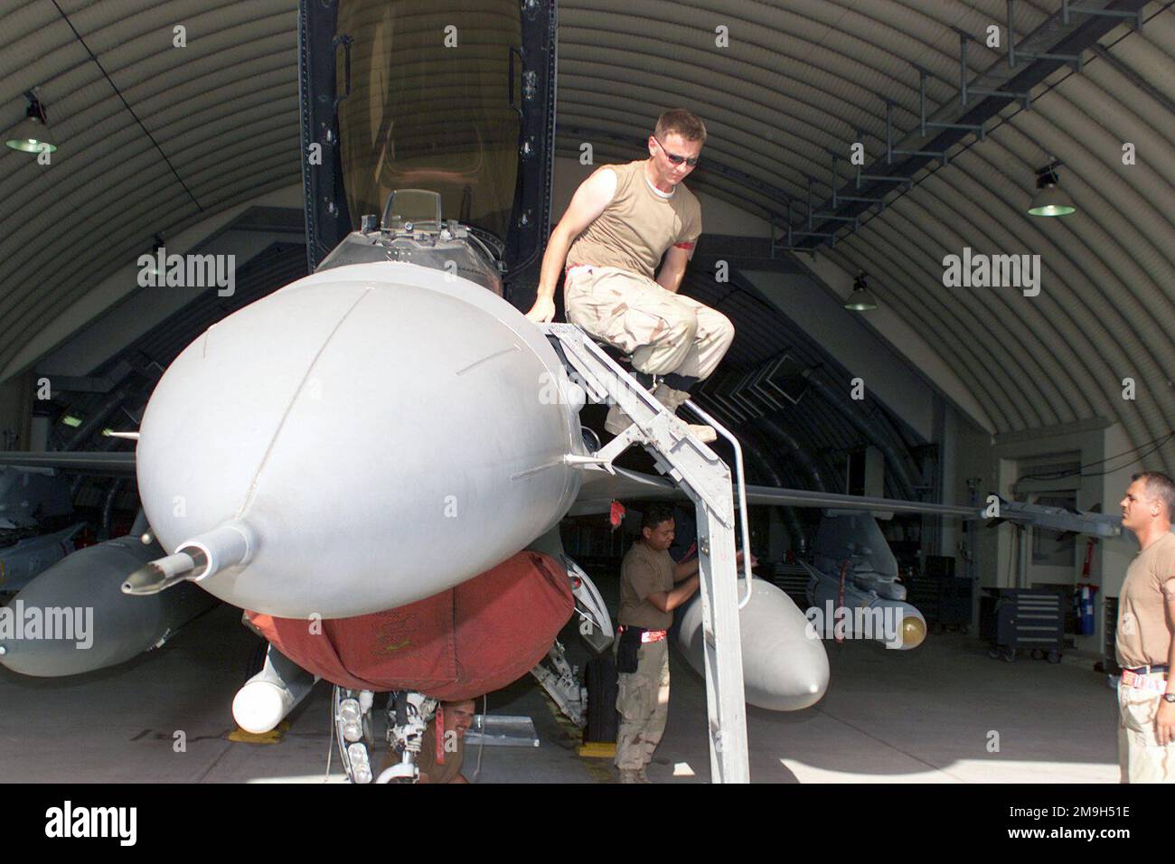 Crew CHIEF, AIRMAN First Class (A1C), Robert Hunt climbs out of the ...