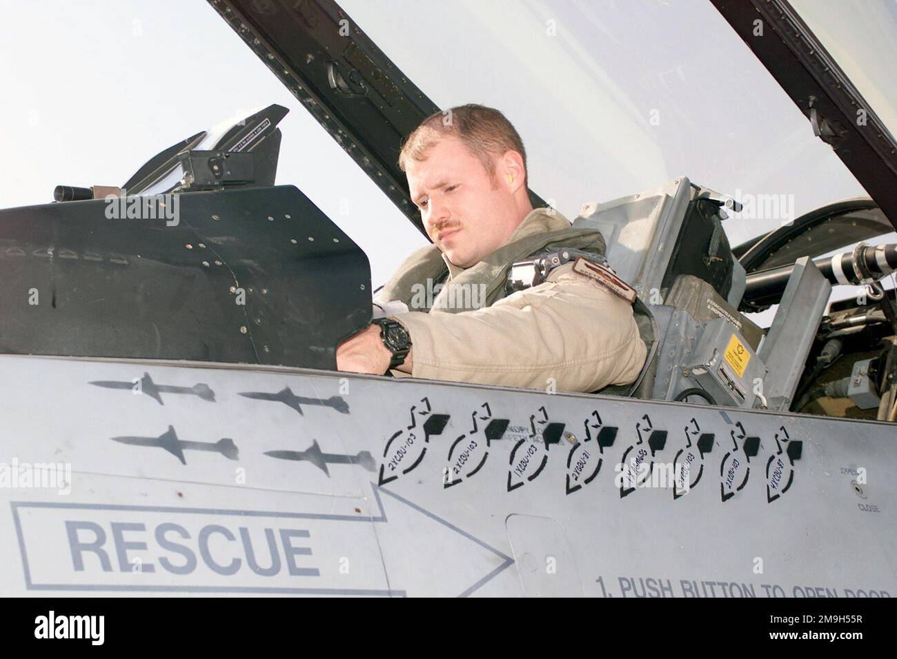 Captain Brett "Zipper" Robinson seated in the cockpit of his F-16 ...