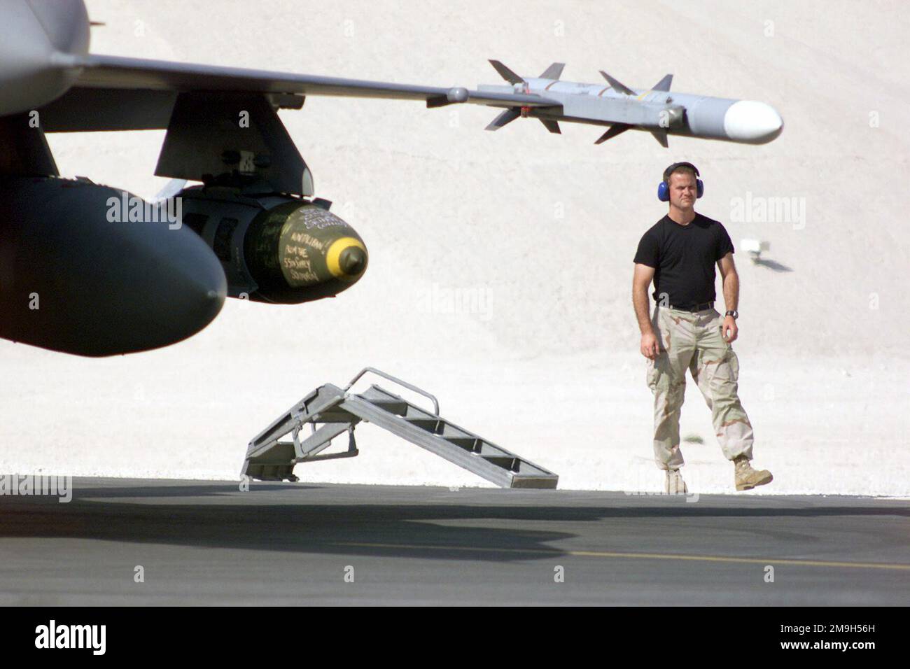 An airman watches as an F-16 falcon from the 389th Fighter Squadron (FS ...